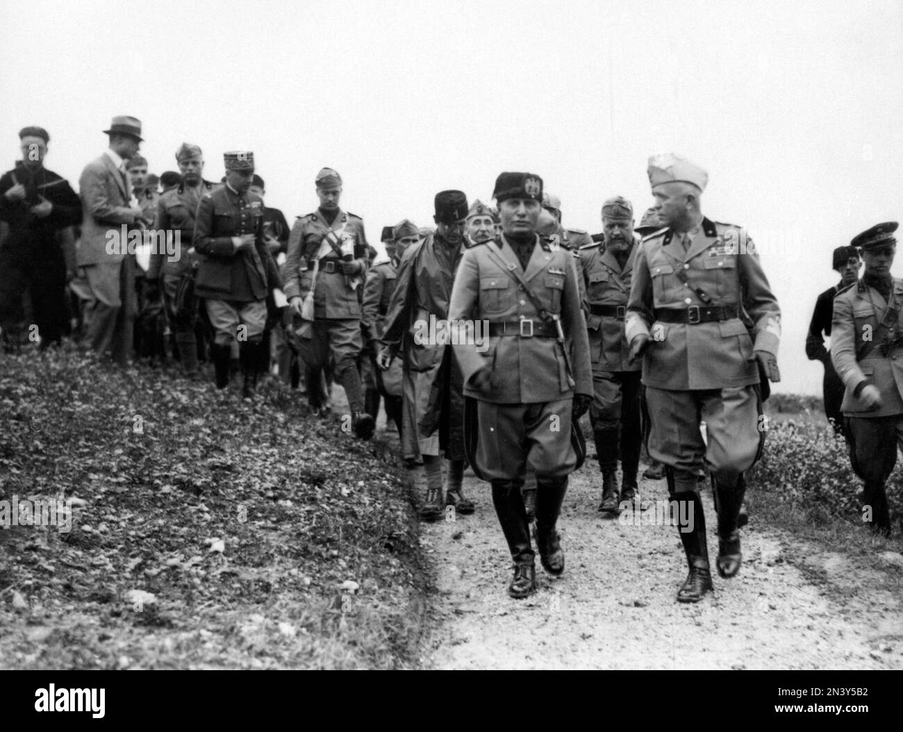 Signor Mussolini and General Badoglio ahead of their staff ...