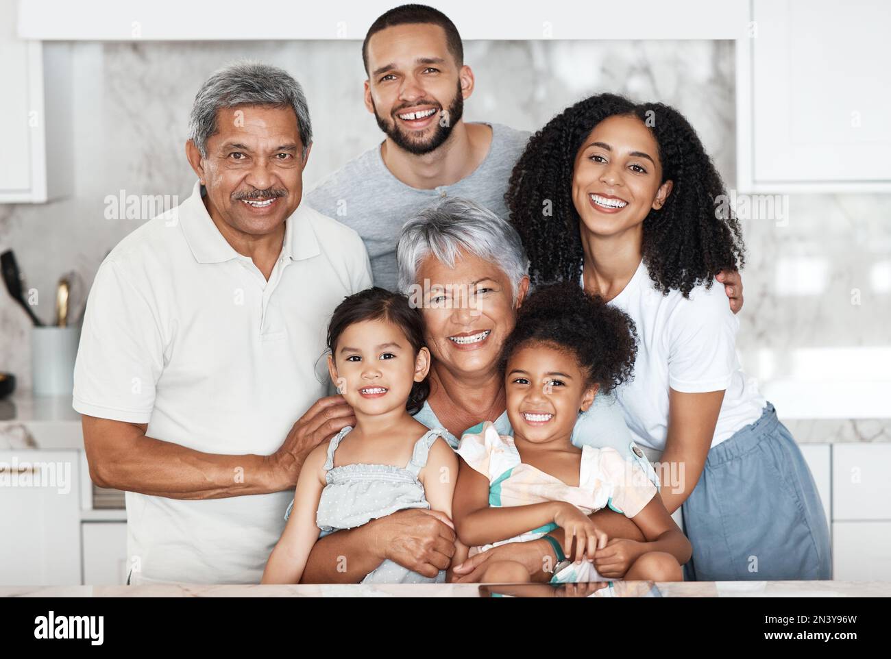 Big family, smile and portrait in home kitchen, bonding and having fun ...