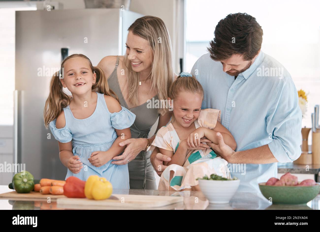 Fun, playful and family cooking food, bonding and children helping in ...