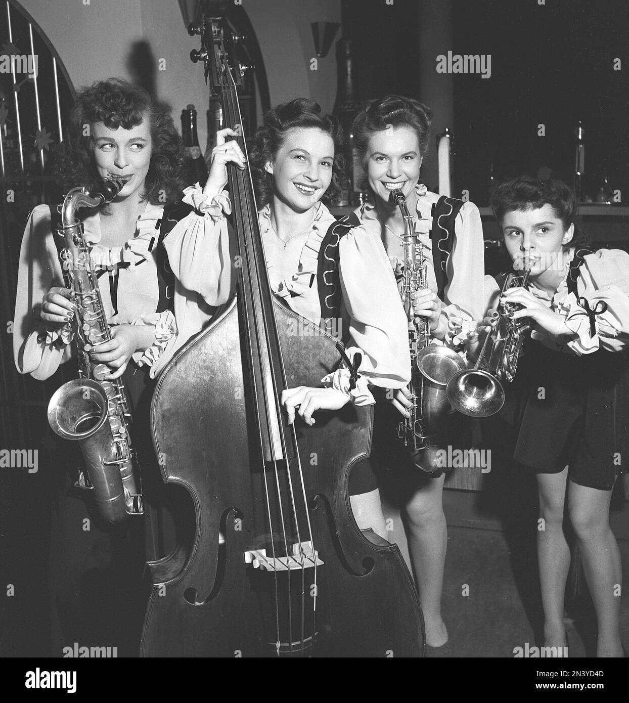 In the 1940s. A group of four young women playing music. Sweden 1946 ...