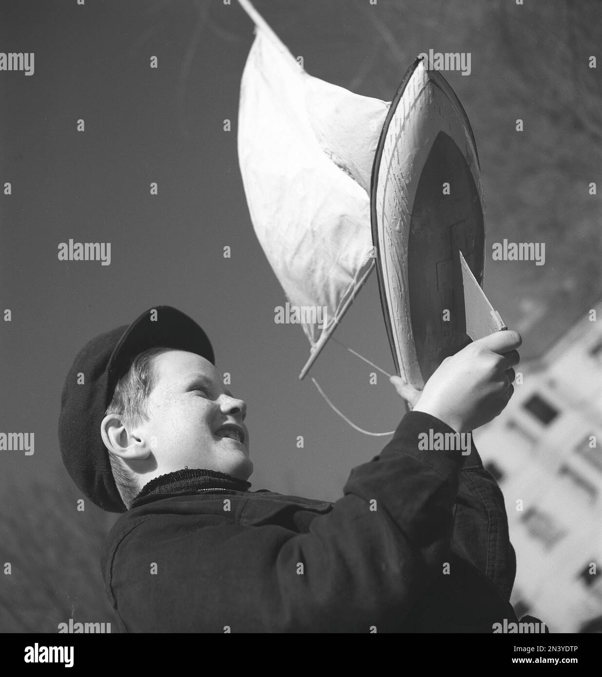 In the 1940s. A boy with his model sailboat pictured when he tries it ...