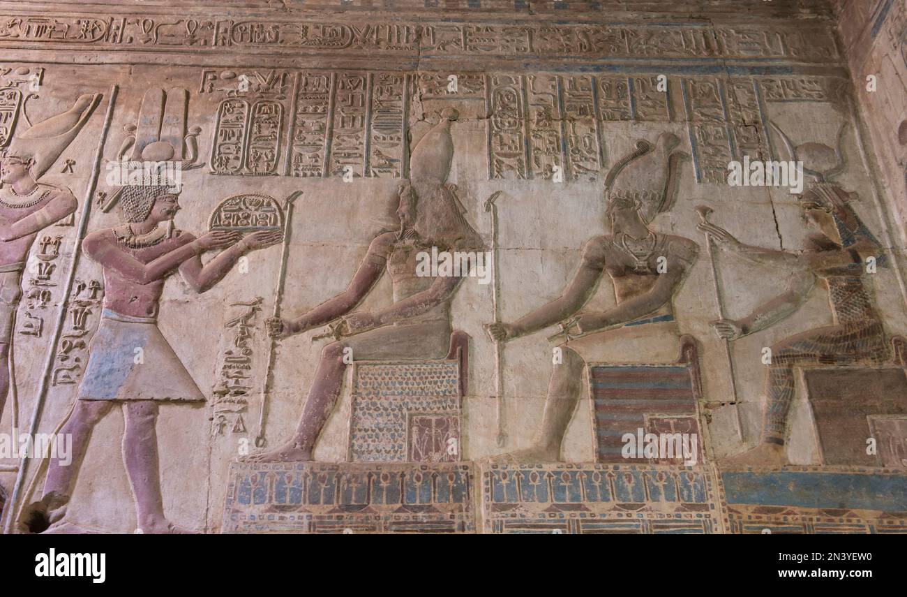 Hieroglypic carving paintings on wall at the ancient egyptian Temple of ...