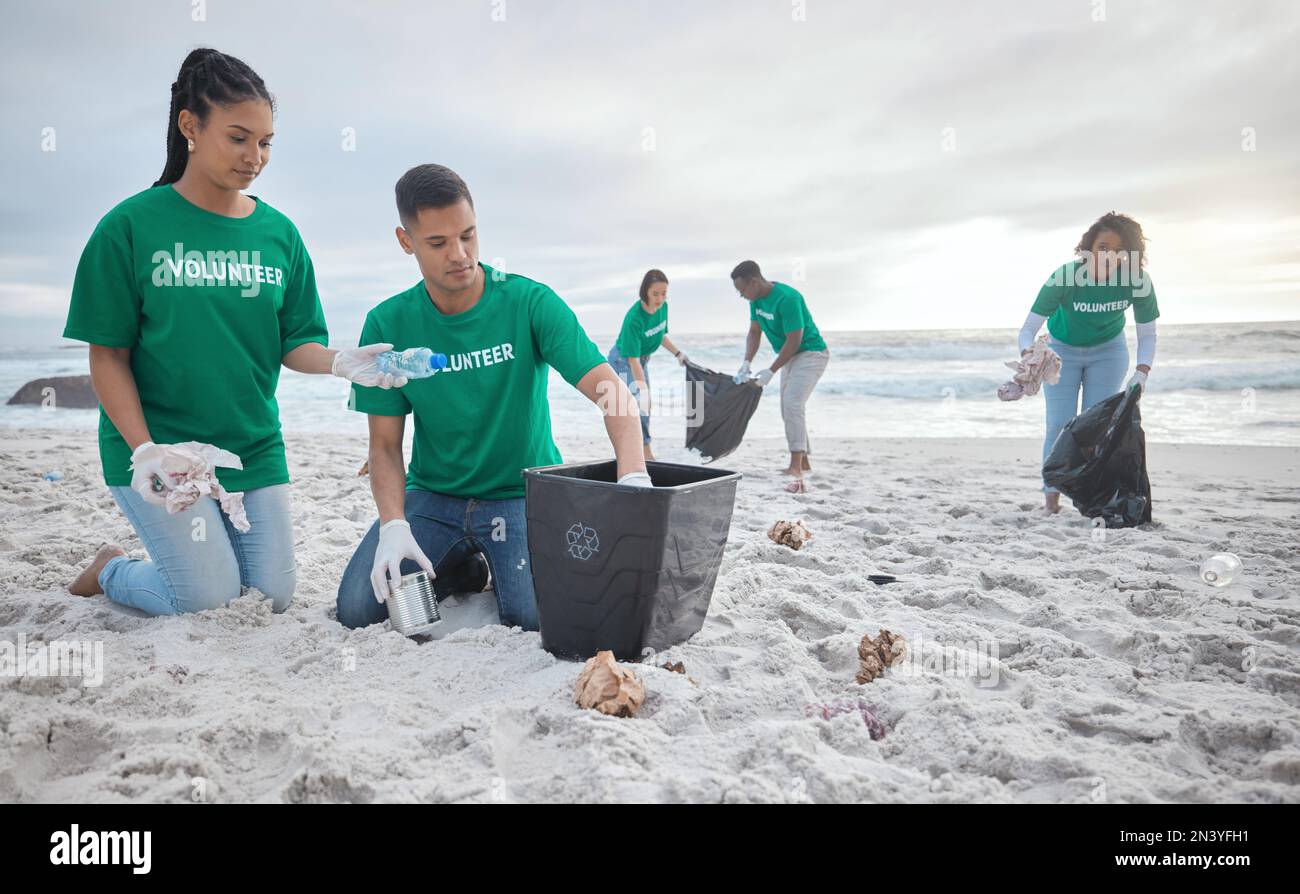 Collaboration, charity and recycling with people on beach for ...