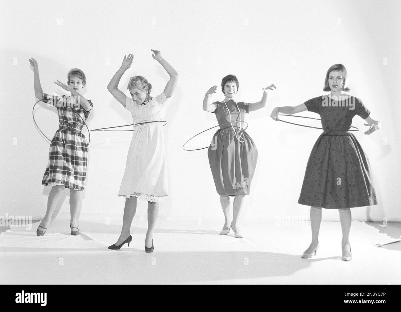 In the 1950s. Women Hula hooping. A craze that culminated during 1958 ...