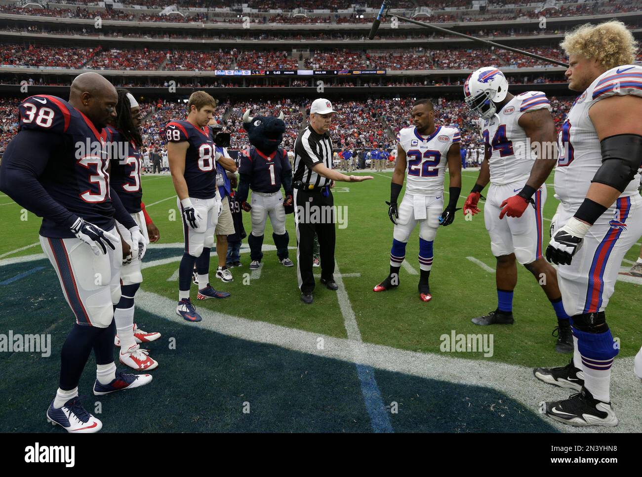 Referee Bill Vinovich (52) conducts the coin toss prior to an NFL ...