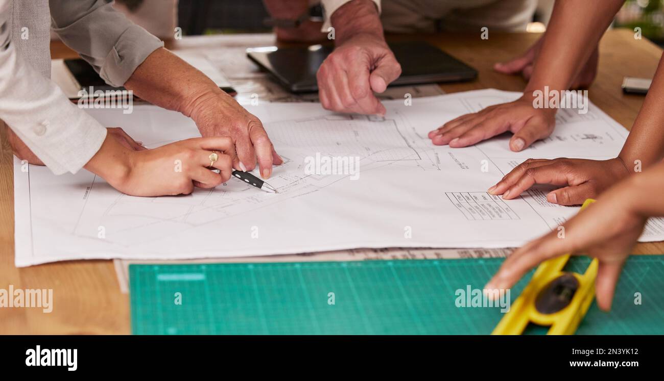 Hands, collaboration and architecture with a designer team planning on ...