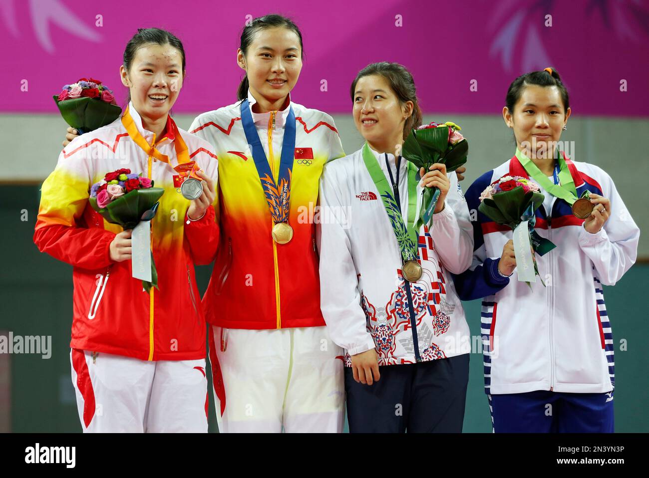 From left, silver medal winner China's Li Xuerui, gold medal winner ...