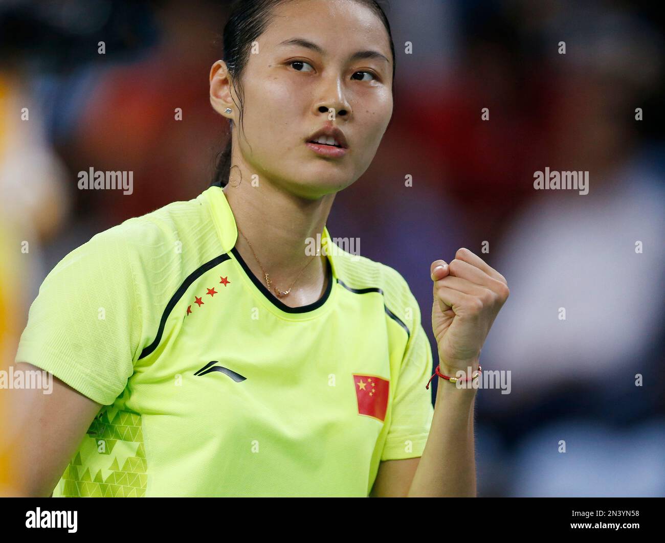 China's Wang Yihan celebrates after winning a point at the women's ...