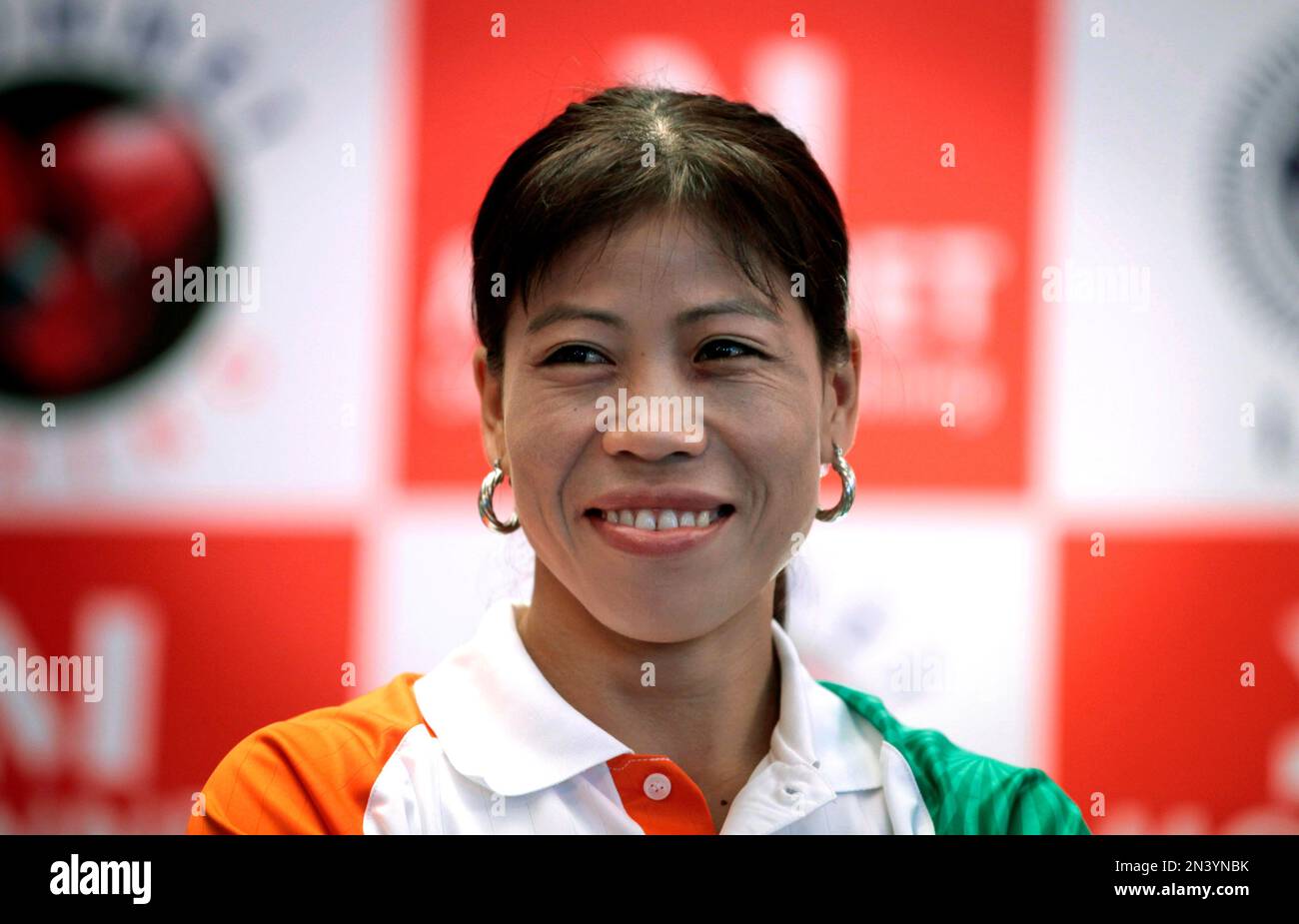 FILE - In this July 22, 2012 file photo, Indian boxer M.C. Mary Kom smiles during a press ...