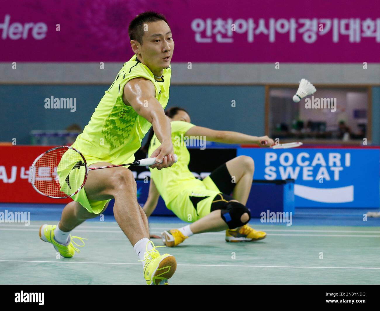 China's Zhang Nan, left, and Zhao Yunlei return a shot to Indonesia's ...