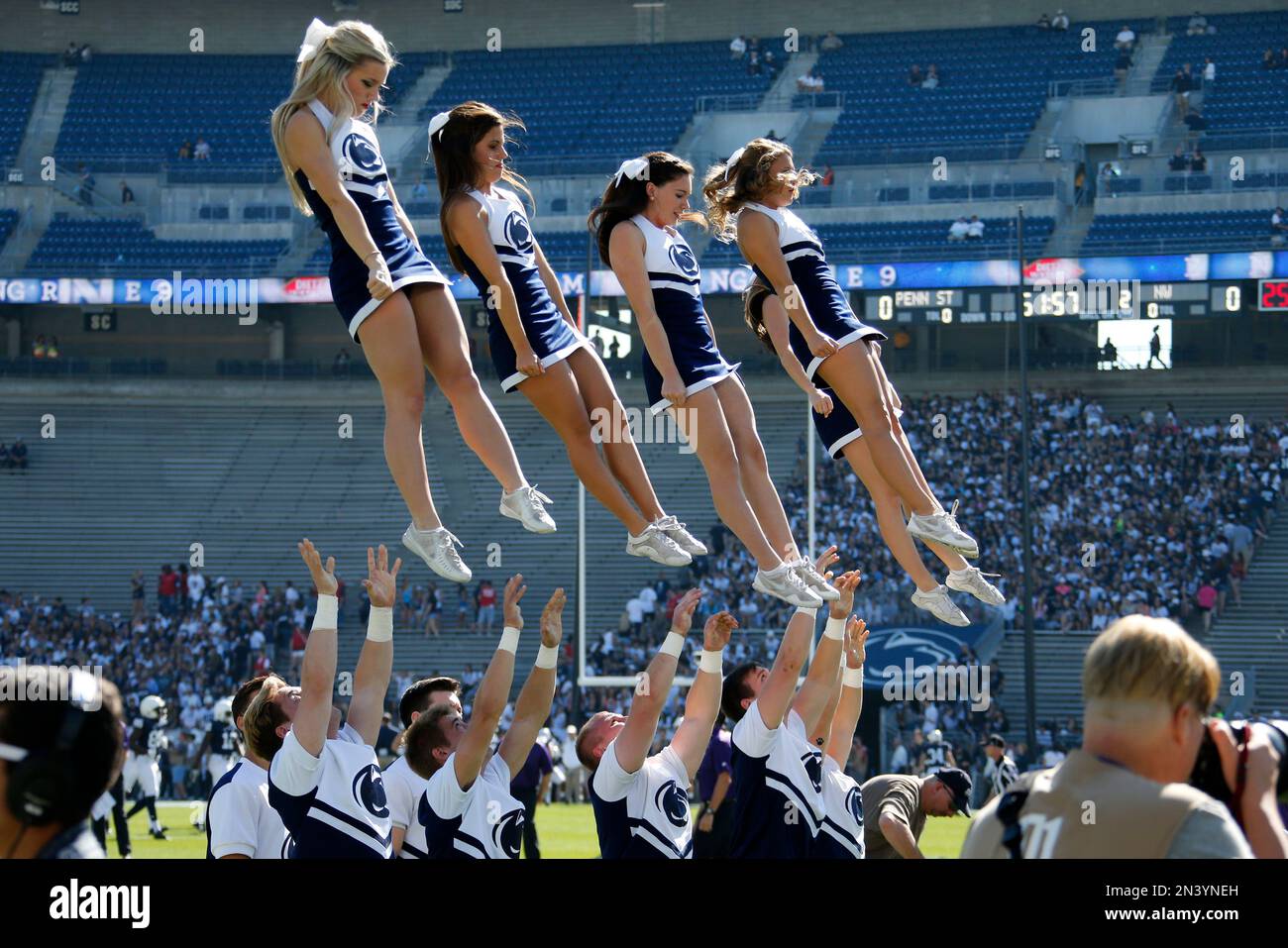A Penn State cheerleaders warm up before an NCAA college football game ...