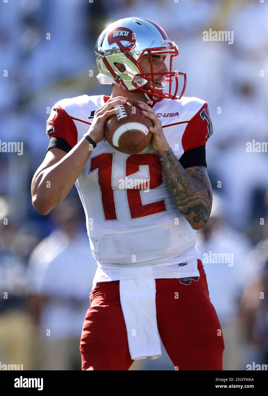 Western Kentucky quarterback Brandon Doughty looks for a receiver in ...