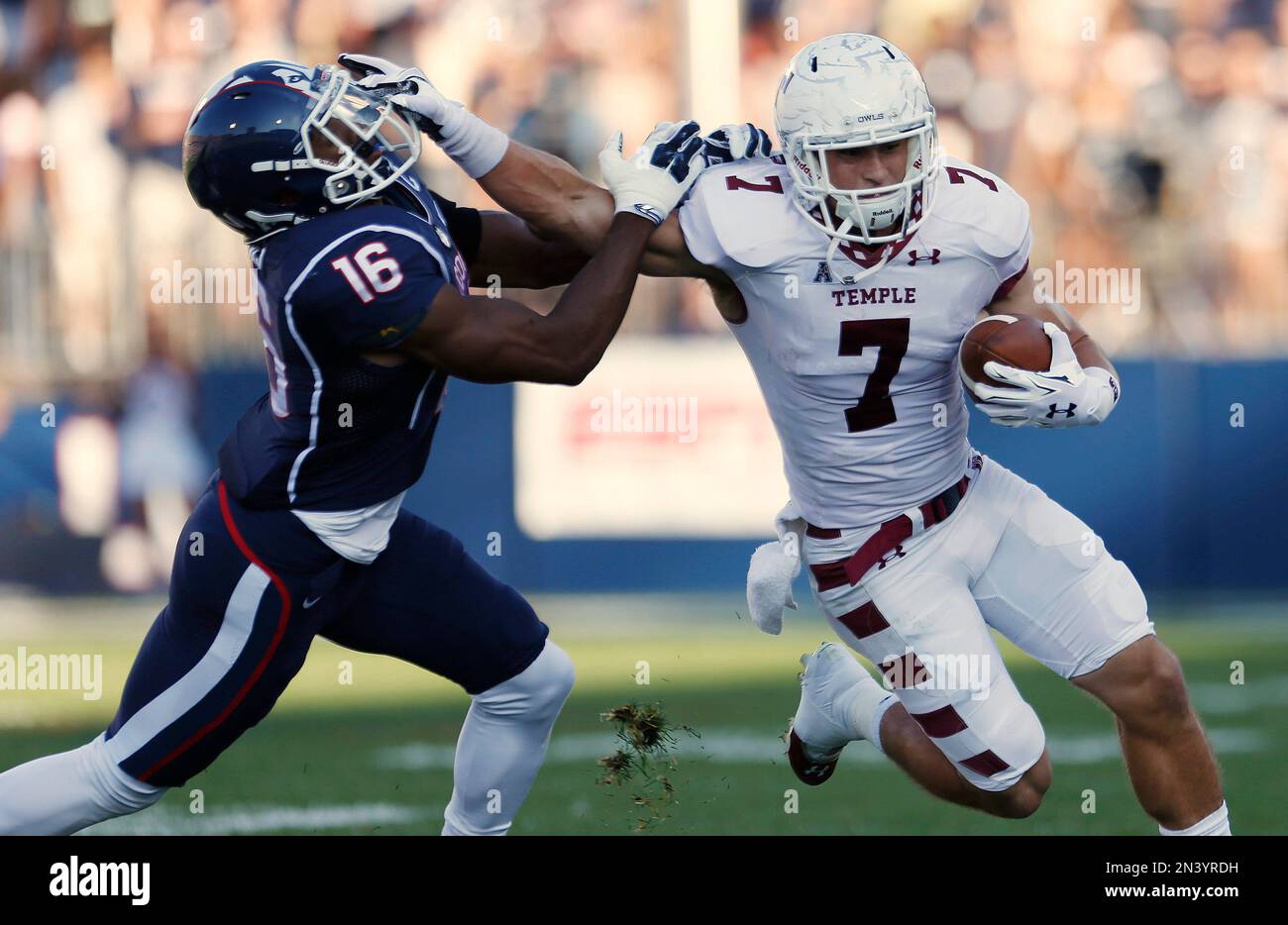 Temple wide receiver John Christopher (7) stiff-arms Connecticut ...