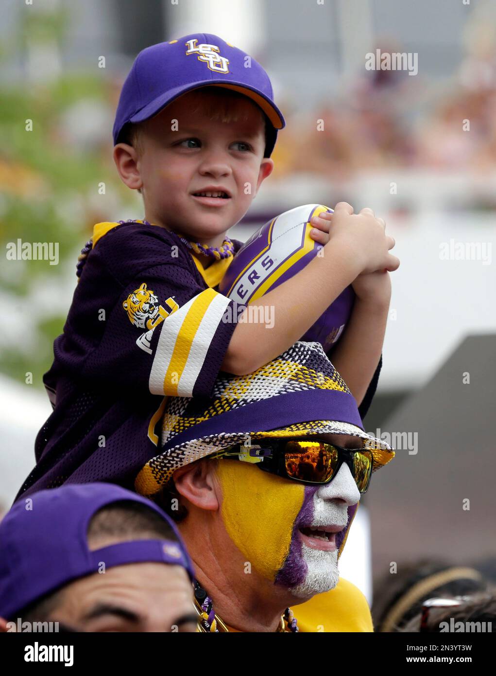 LSU fans wait for the team to arrive at Tiger Stadium before an NCAA ...