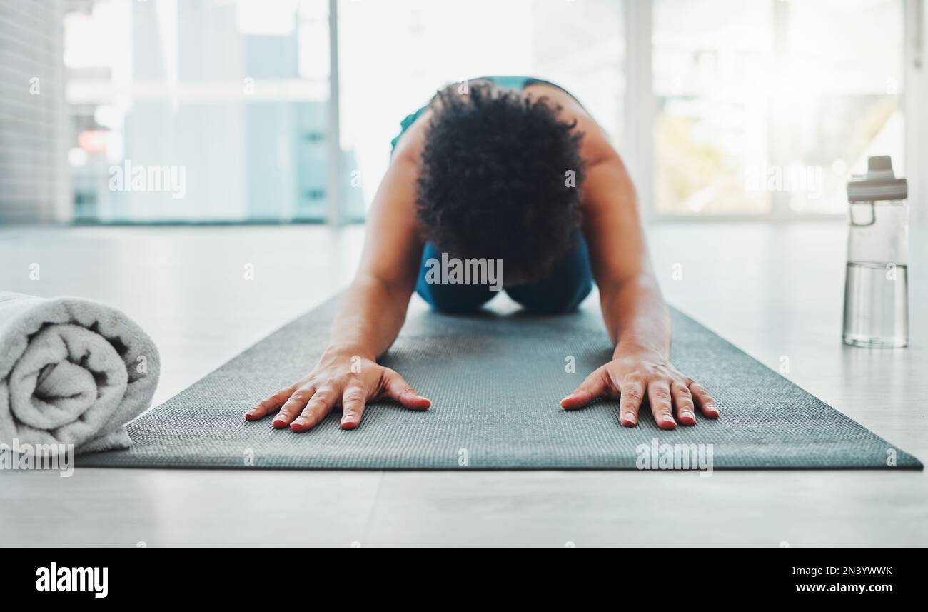 Yoga, stretching and fitness of a black woman in a gym for zen, relax ...