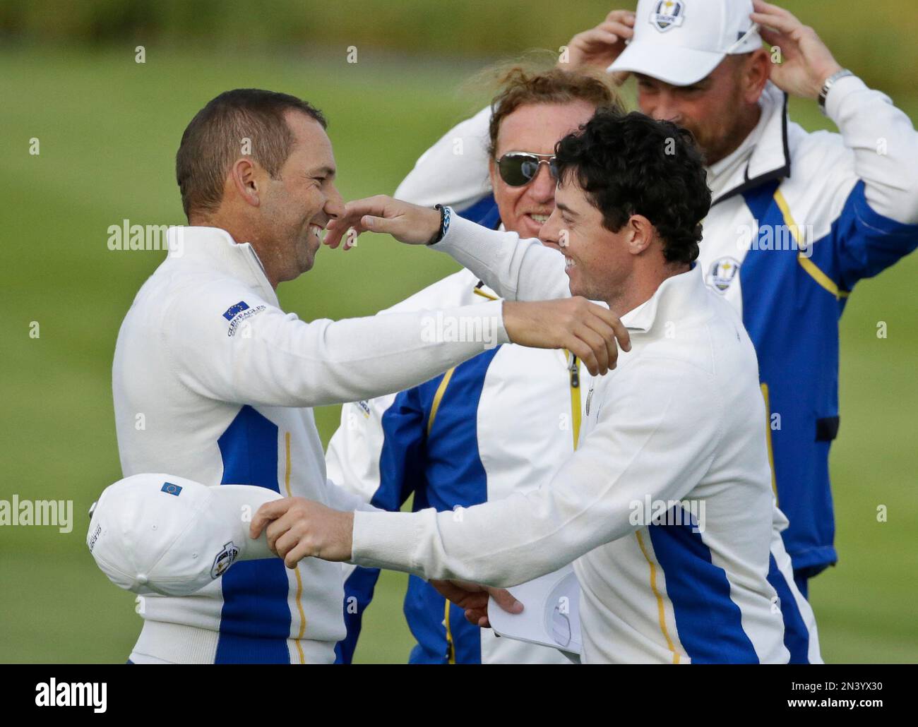 Europe's Rory McIlroy and Sergio Garcia, left, embrace on the 16th ...
