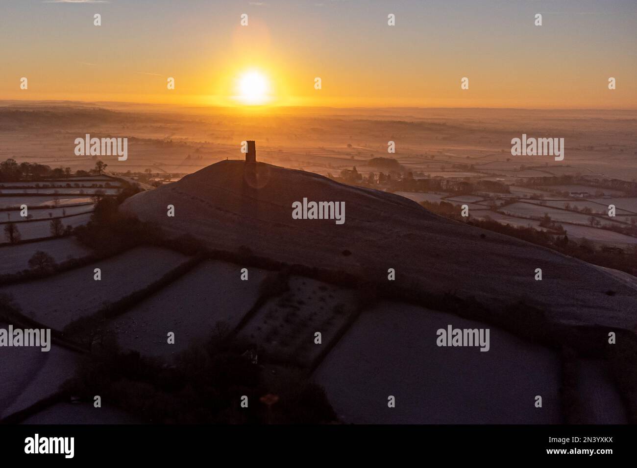 The sun rises over the Somerset Levels and strikes fields around ...