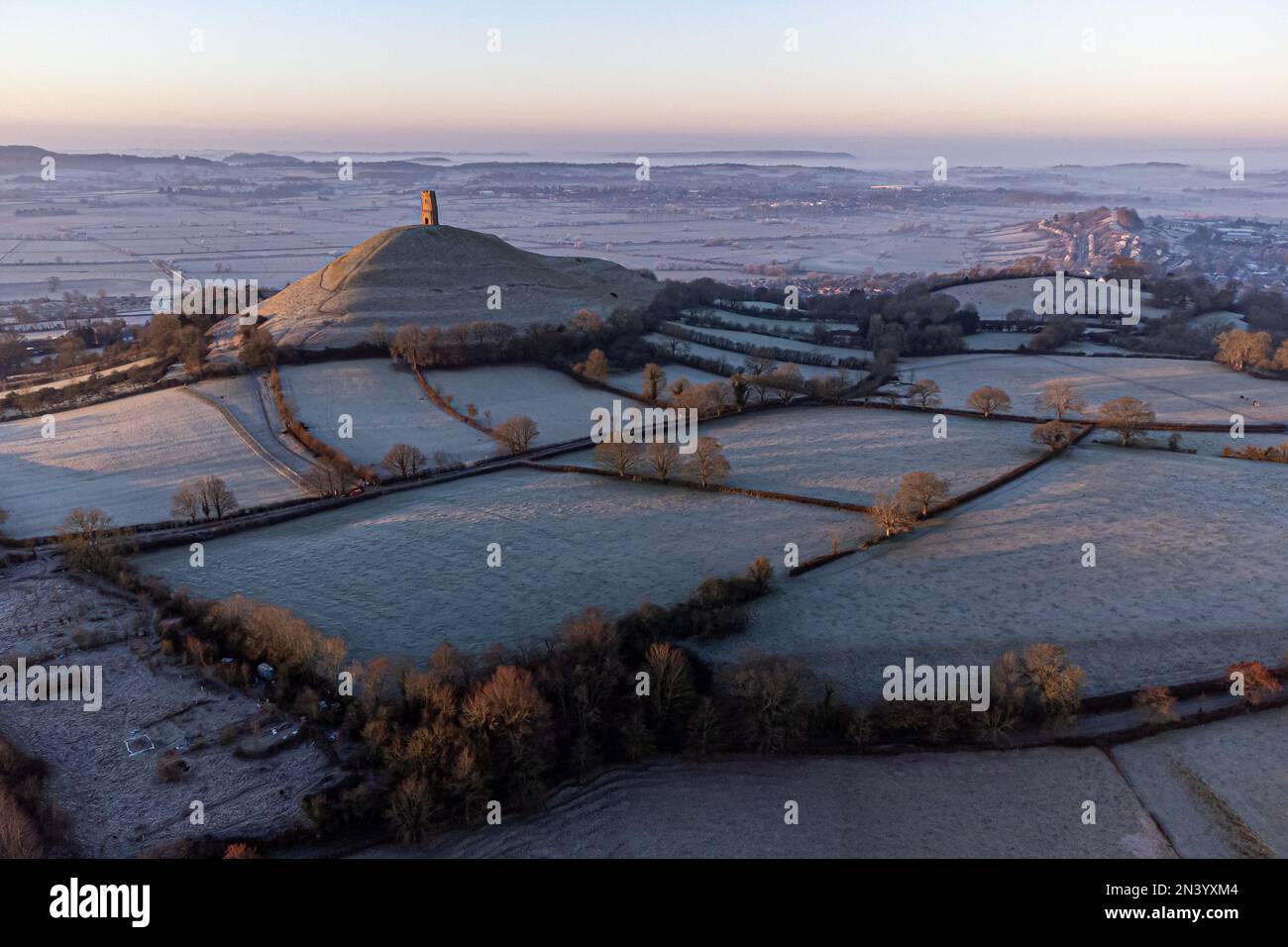 The sun rises over the Somerset Levels as frost forms on fields around ...