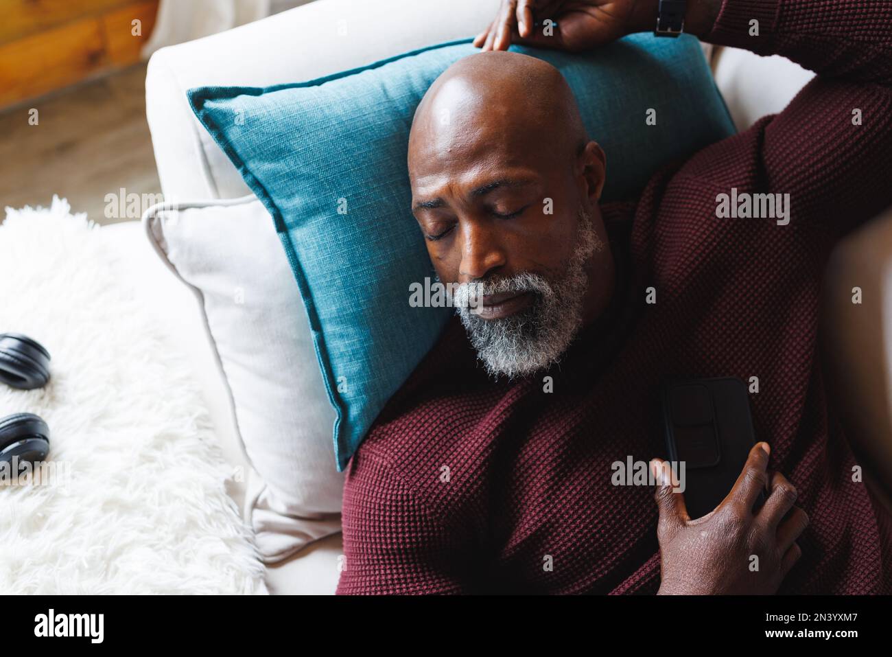 High angle view of bald african american senior man with mobile phone ... High angle view of bald african american senior man with mobile phone ...