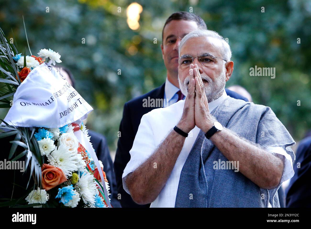 Prime Minister Narendra Modi of India gestures after laying a wreath at ...