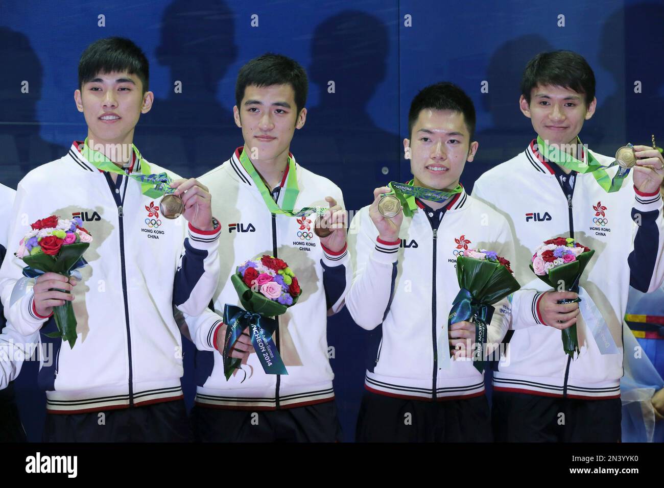 Hong Kong’s Tang Cheuk Yan, left, Yip Tsz Fung, 2nd left, Au Chun Ming ...