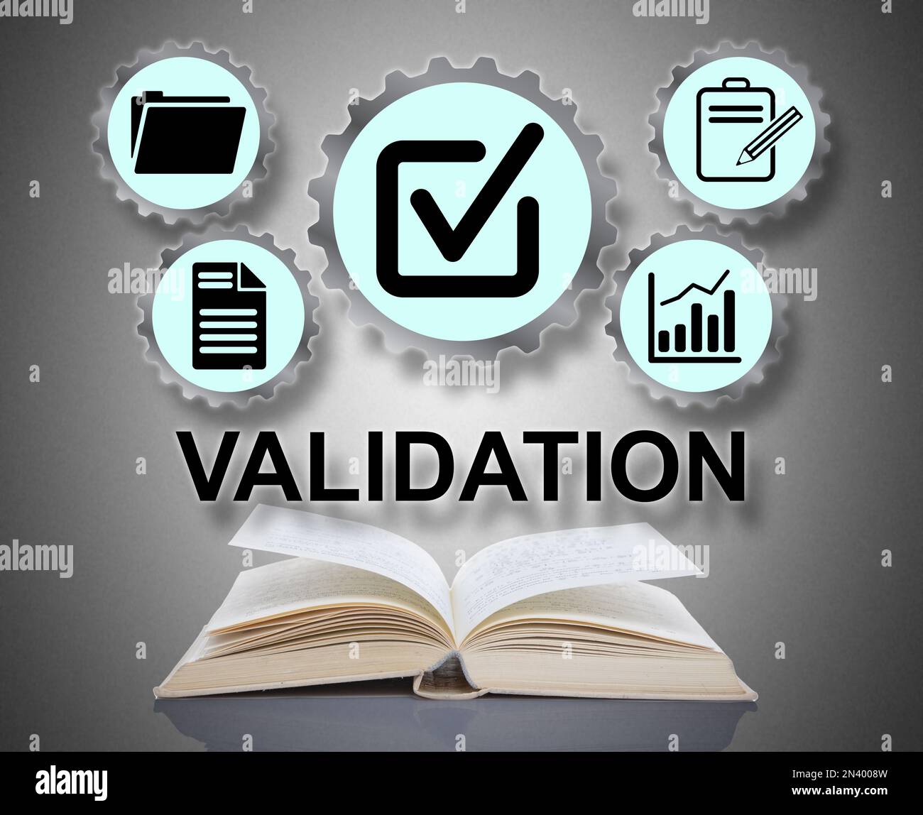 Validation concept above an open book Stock Photo - Alamy