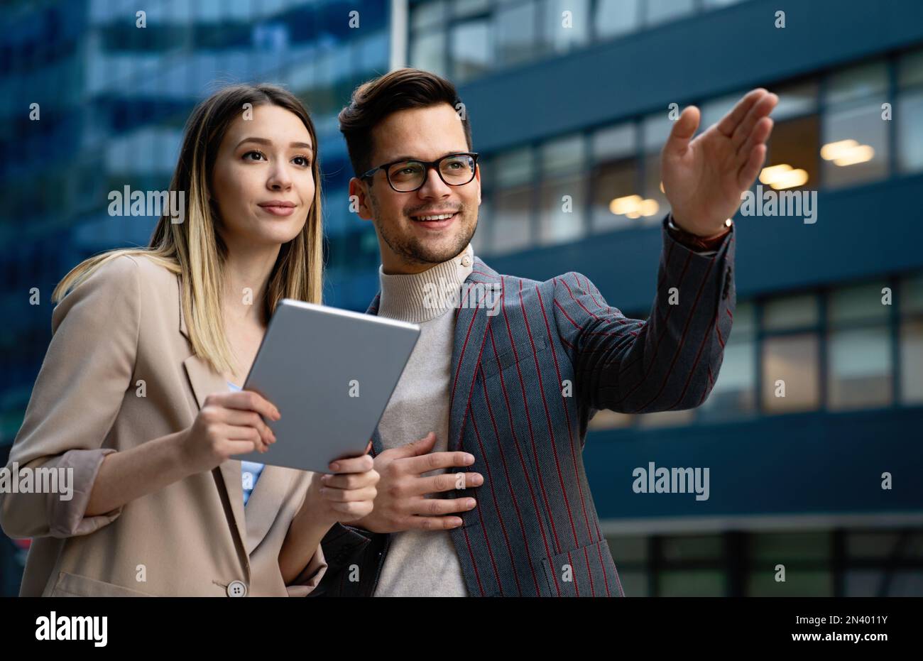 Successful business people, designer enjoying work together. Business ...