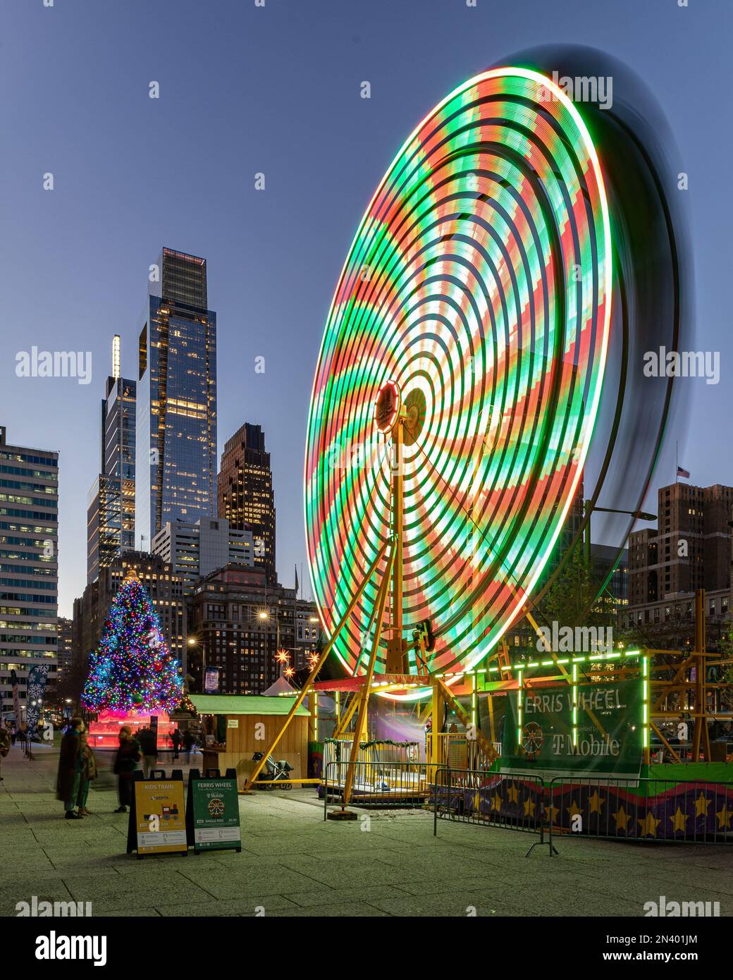 A long exposure of a wheel in a ride in a pleasure park by modern ...
