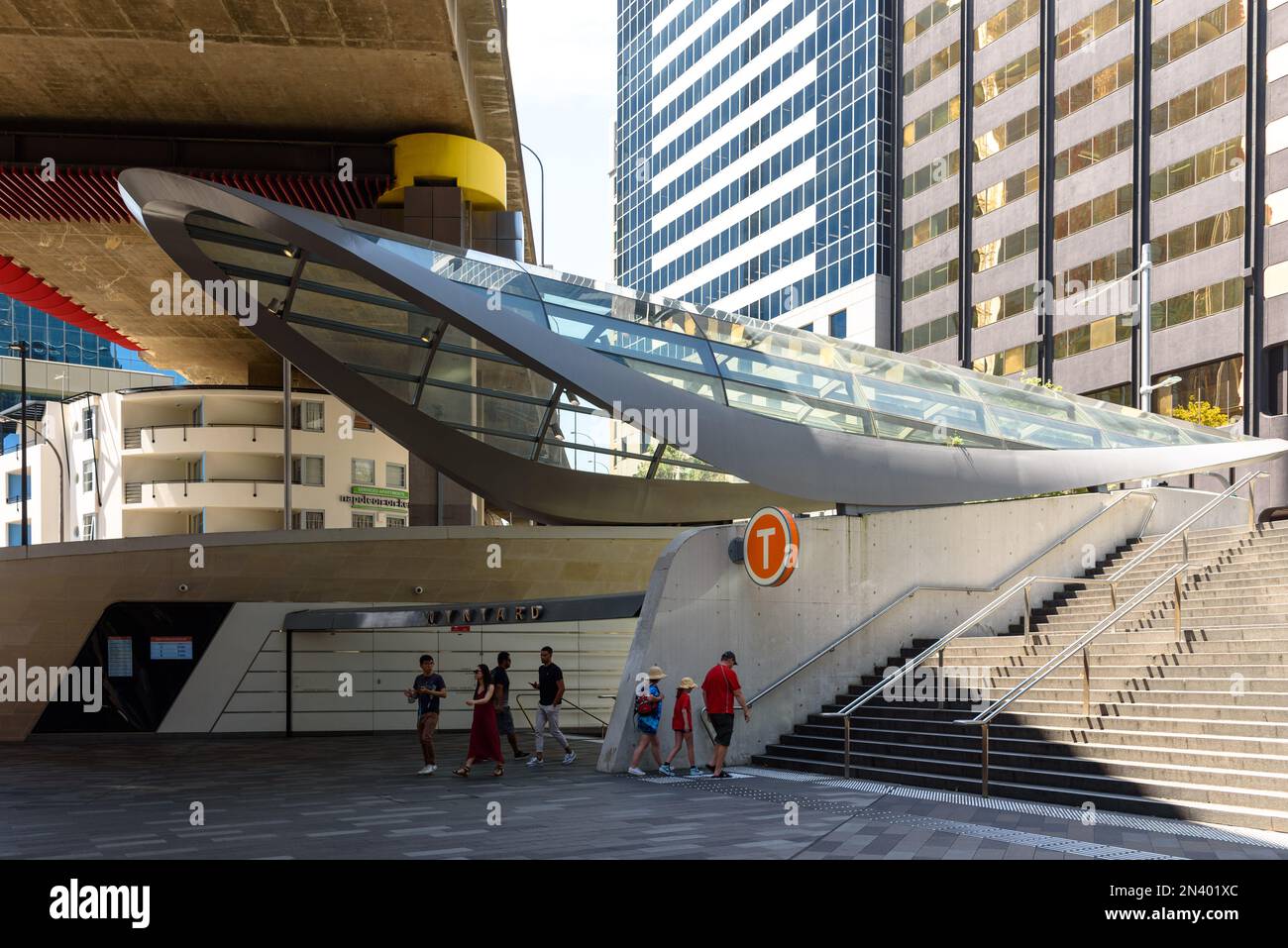 People walking by the entrance to the Wynyard Walk pedestrian tunnel at ...