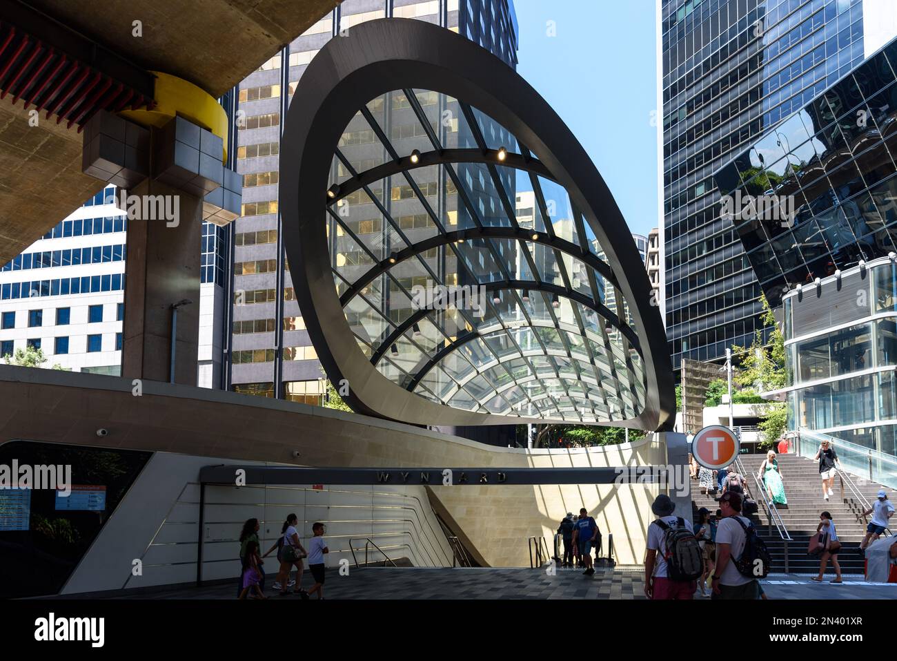 People walking by the entrance to the Wynyard Walk pedestrian tunnel at ...