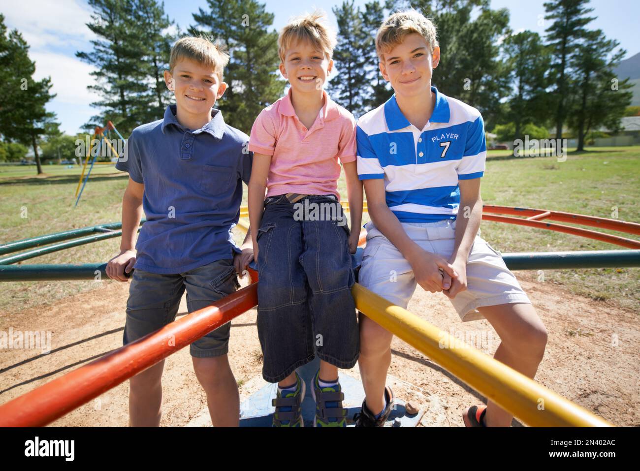 Brothers through friendship. Portrait of three young brothers sitting ...