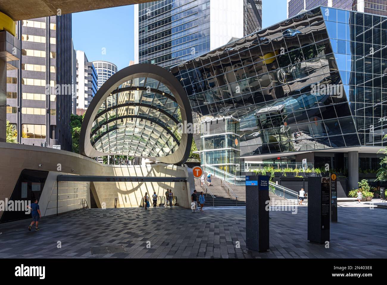 People walking by the entrance to the Wynyard Walk pedestrian tunnel at ...