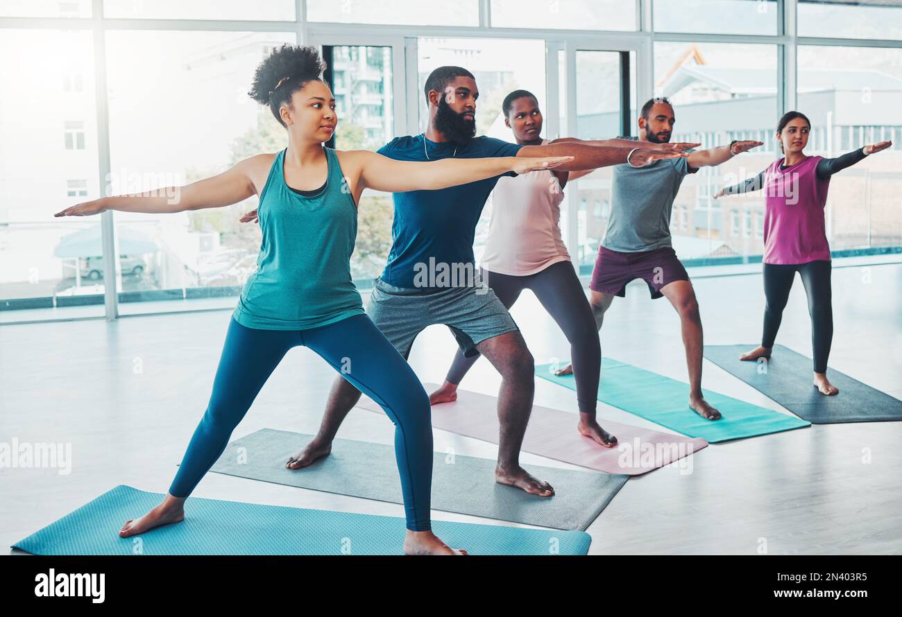 Yoga class, warrior exercise and people together for fitness, peace and wellness. Diversity men ...