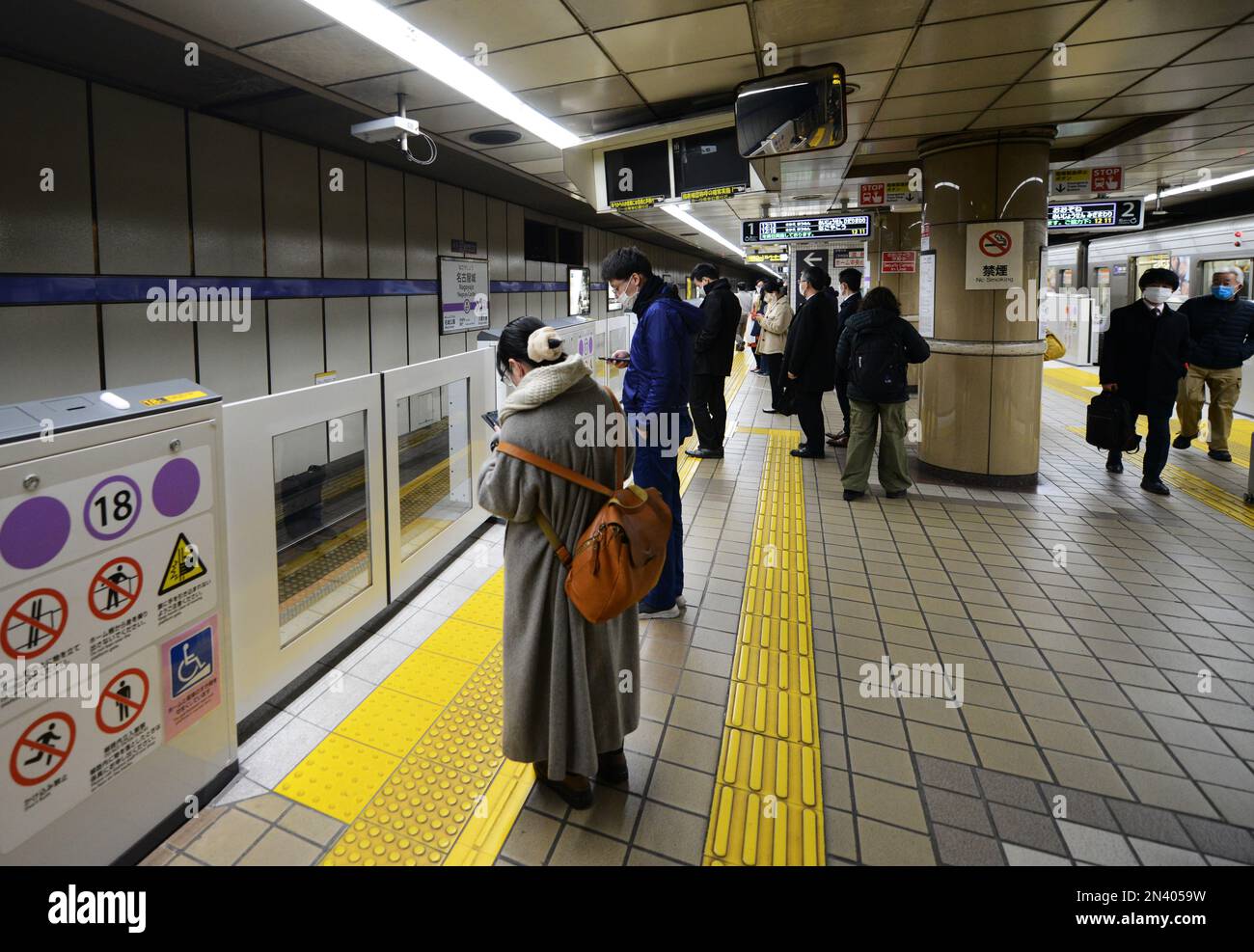 Passengers waiting for the Metro train in Nagoya, Japan Stock Photo - Alamy