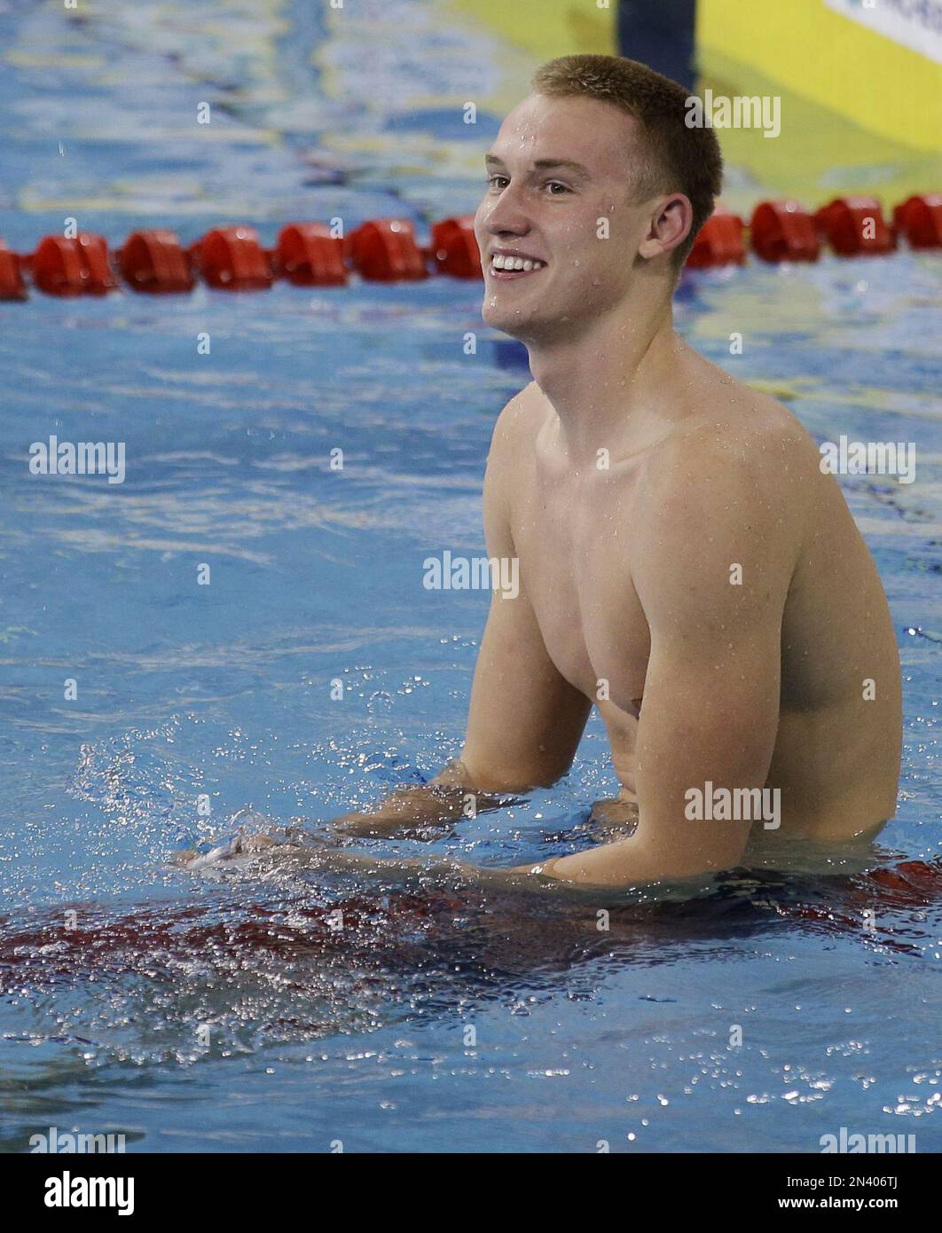 Kazakhstan's Dmitriy Balandin sits on a lane rope after winning the men ...