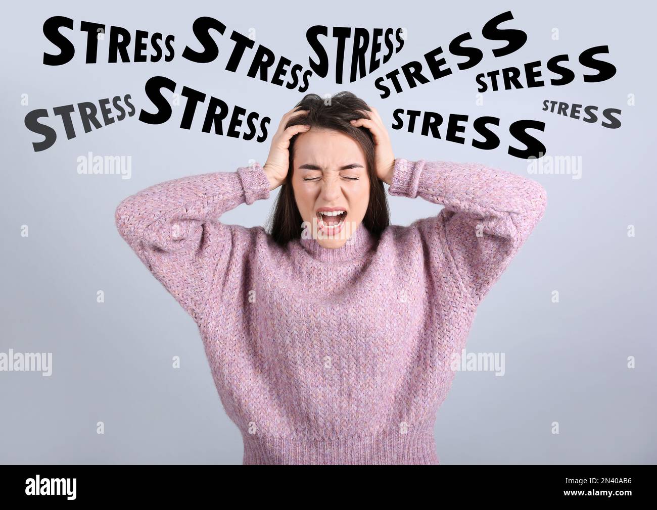 Stressed young woman and text on light grey background Stock Photo - Alamy
