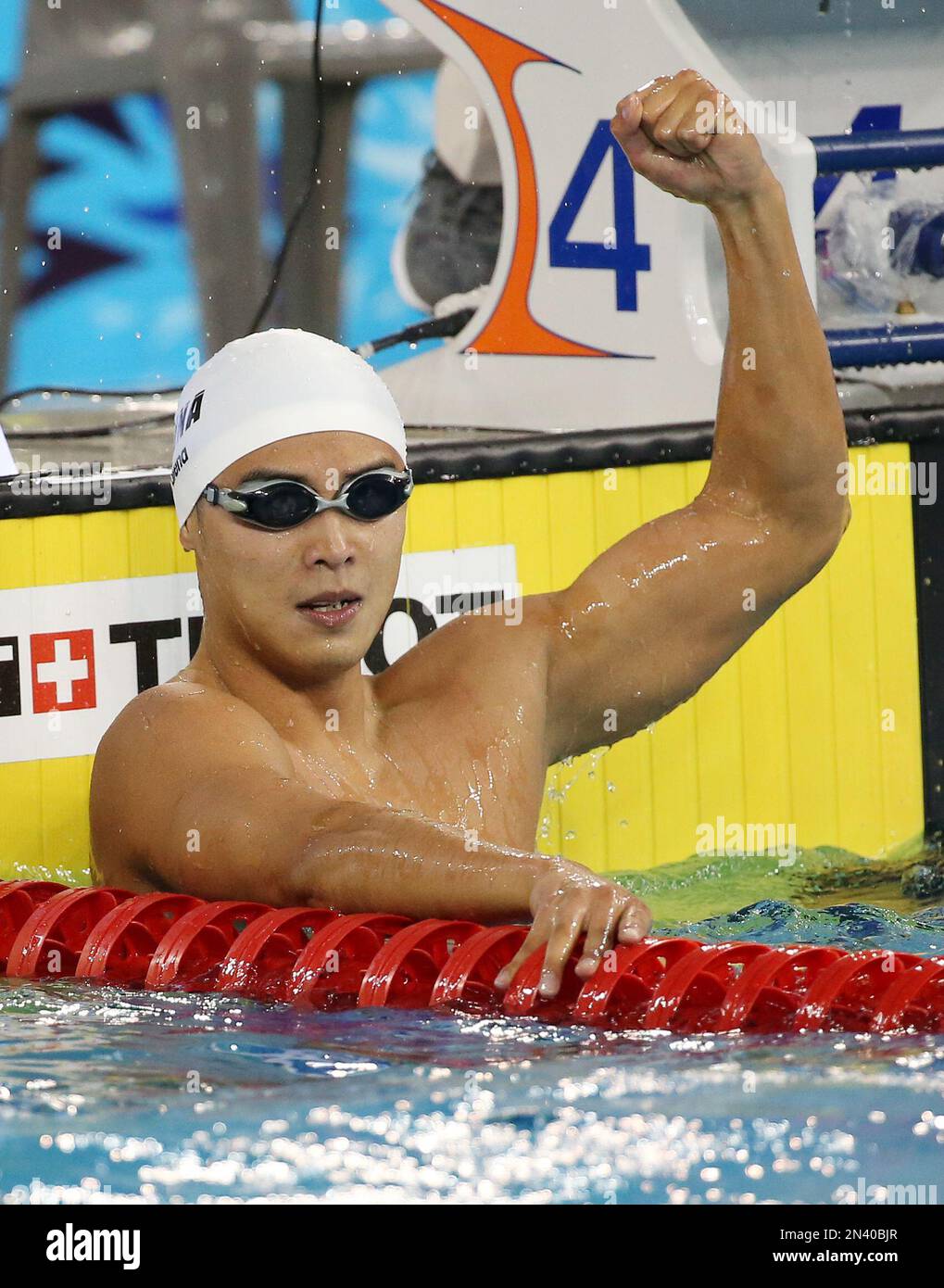 China's Shi Yang celebrates after winning the men's 50m butterfly ...