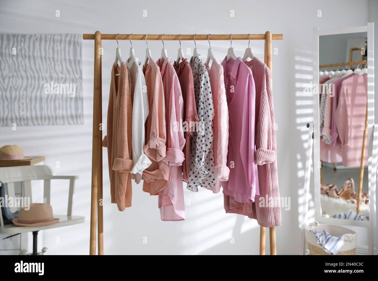 Rack with stylish women's clothes indoors. Interior design Stock Photo ...