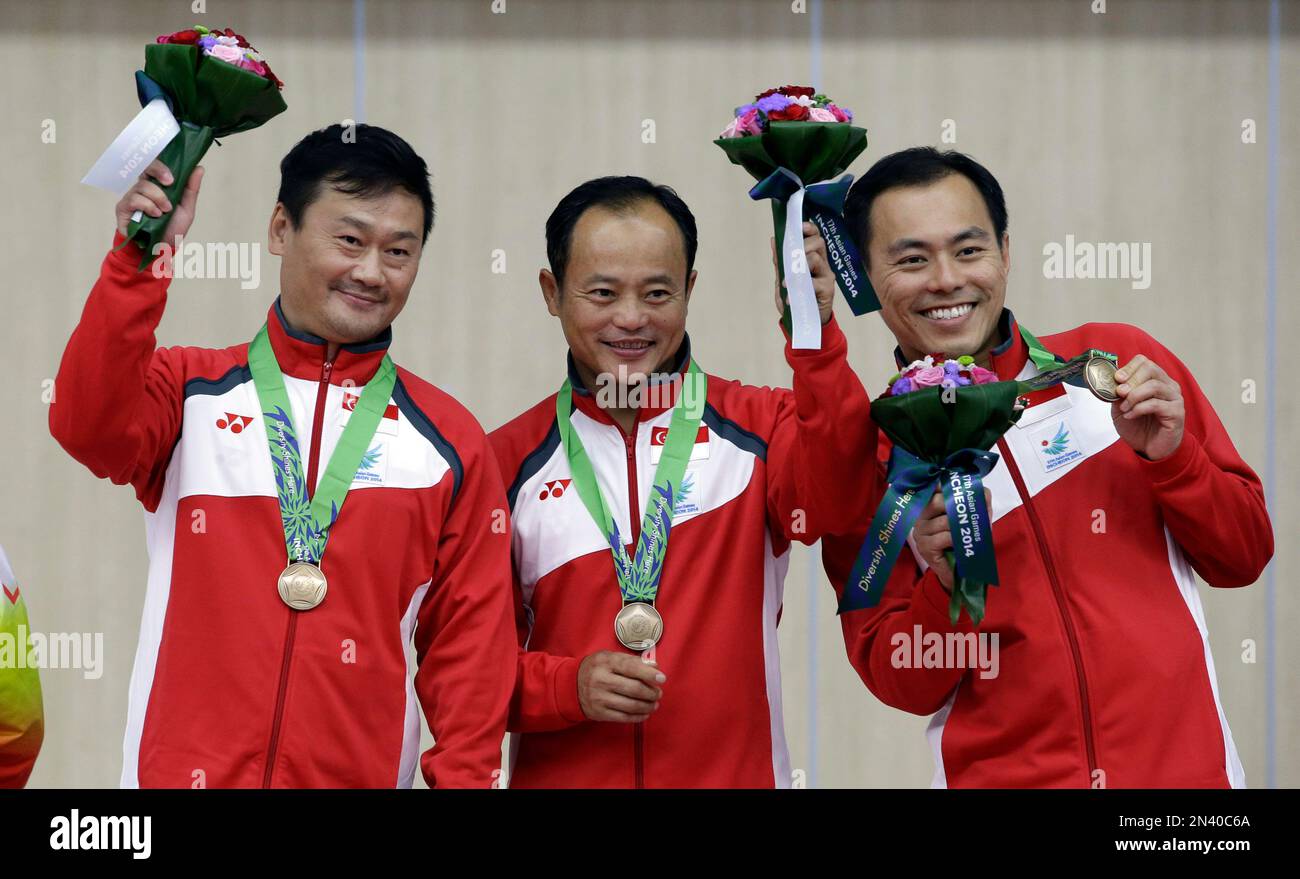 Bronze medal winners Singapore's Gai Bin, Lim Swee Hon and Poh Lip Meng ...