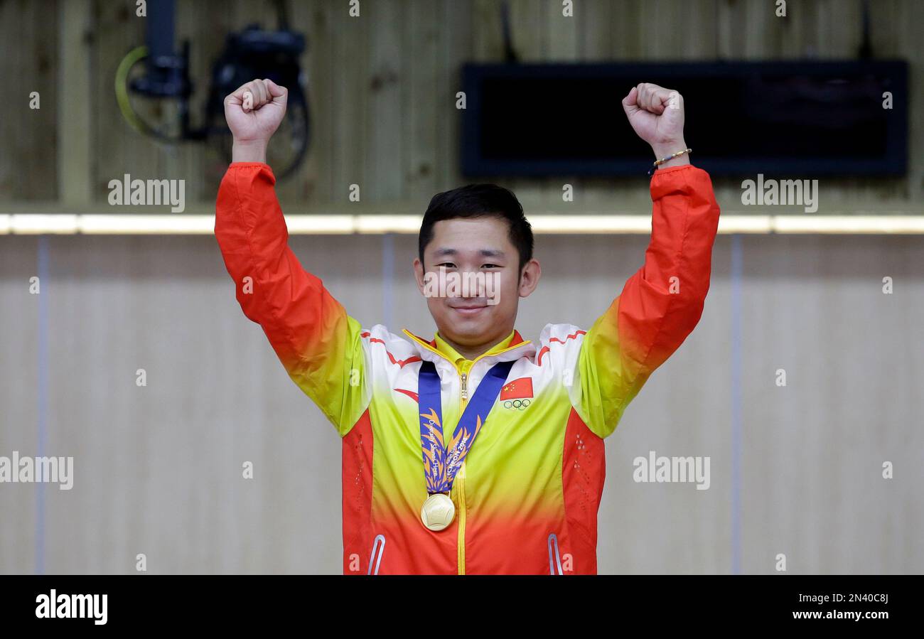 Gold medal winner China's Ding Feng celebrates during the award ...