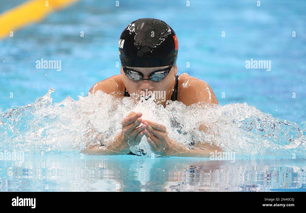 China's He Yuzhe swims during her women's 50m breaststroke heat at the ...
