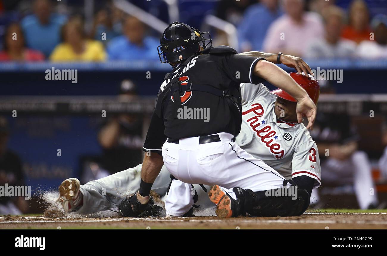 Philadelphia Philles' Marion Byrd (3) is tagged out at home by Miami ...