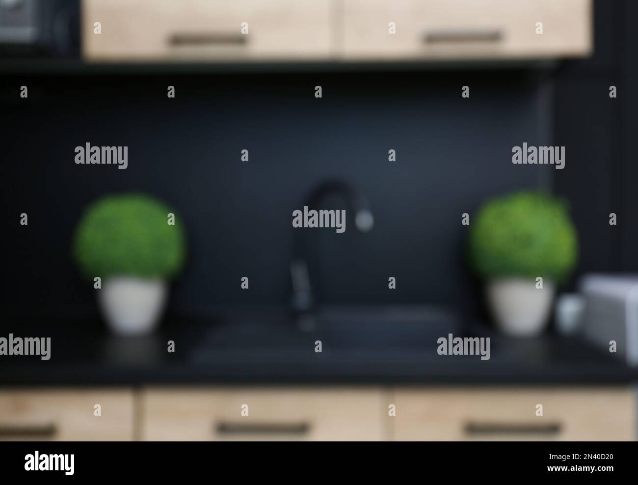 Blurred view of kitchen interior with modern furniture Stock Photo - Alamy