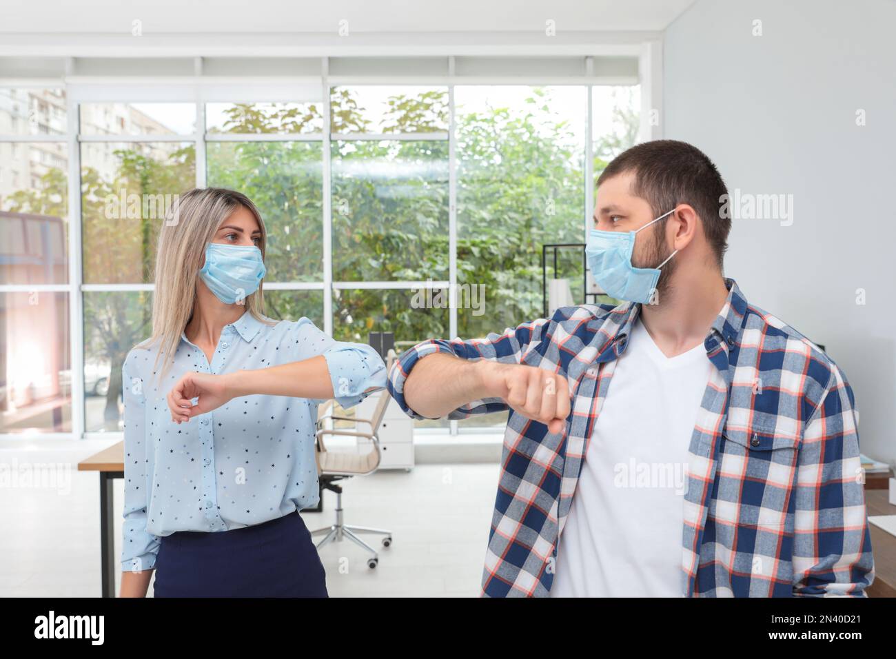 Man woman in masks bumping hi-res stock photography and images - Alamy