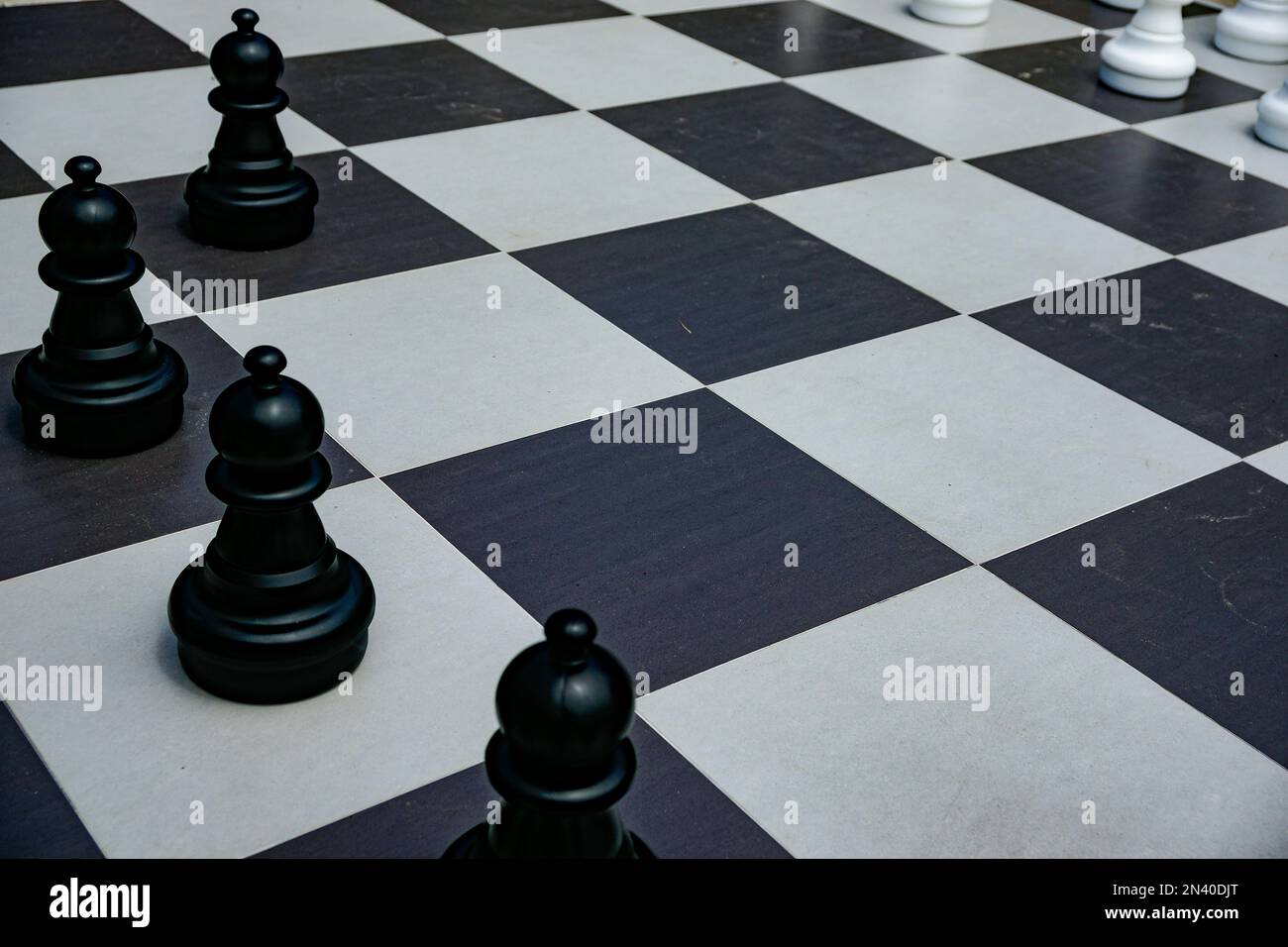 Black and white pattern chess board with black pawns Stock Photo - Alamy