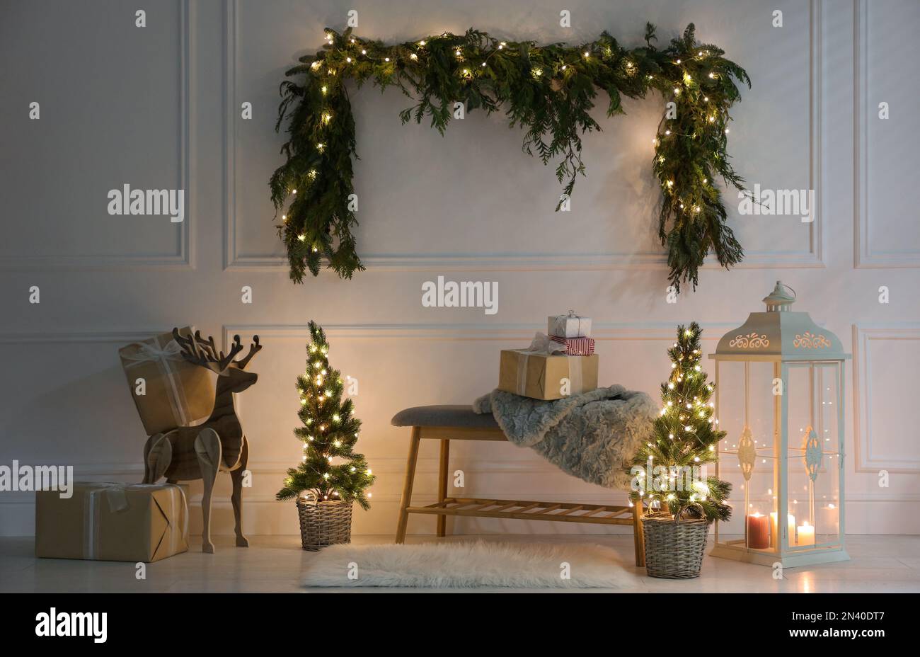 Beautiful Christmas themed photo zone with fir decor Stock Photo - Alamy