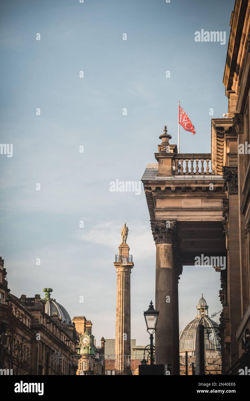 A vertical shot of the Grey's Monument in the background of an old ...