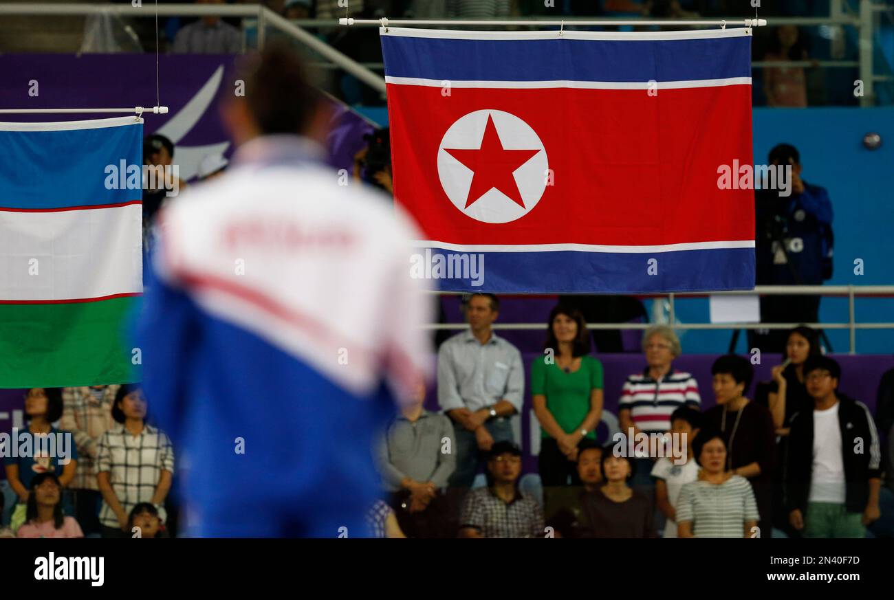 Gold medallist North Korea's Hong Un-jong stands in front of her ...