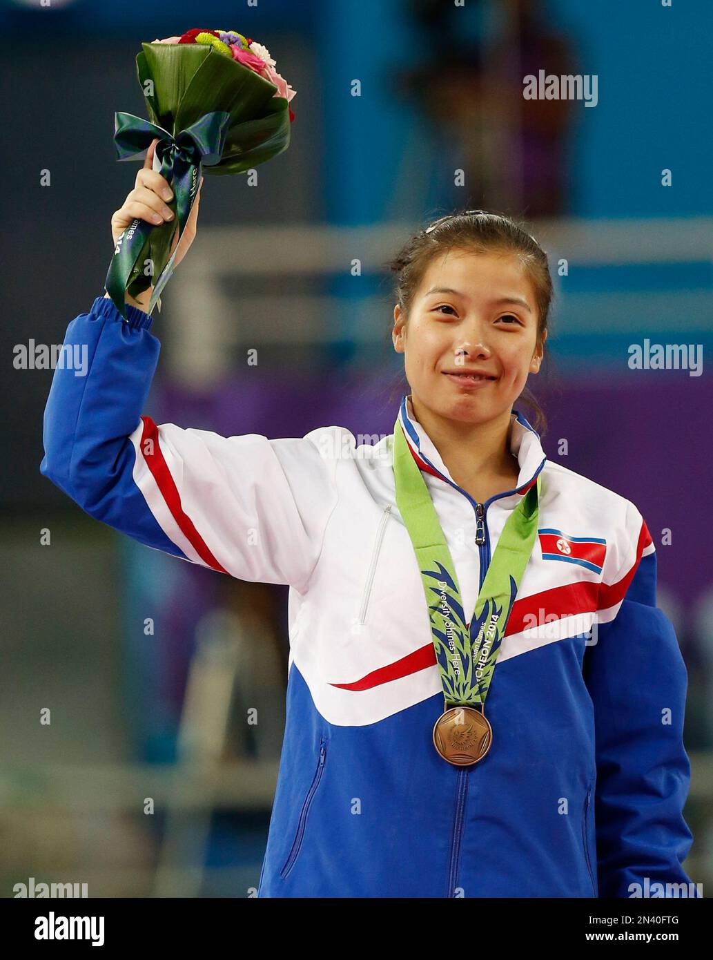 Bronze medallist North Korea's Kang Yong-mi acknowledges the crowd ...