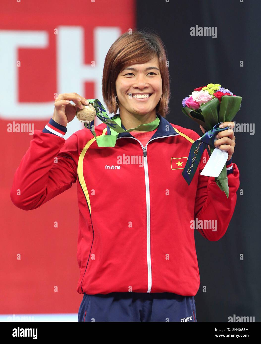 Vietnam's Tan Thi Ly displays her bronze medal she won in the women's ...